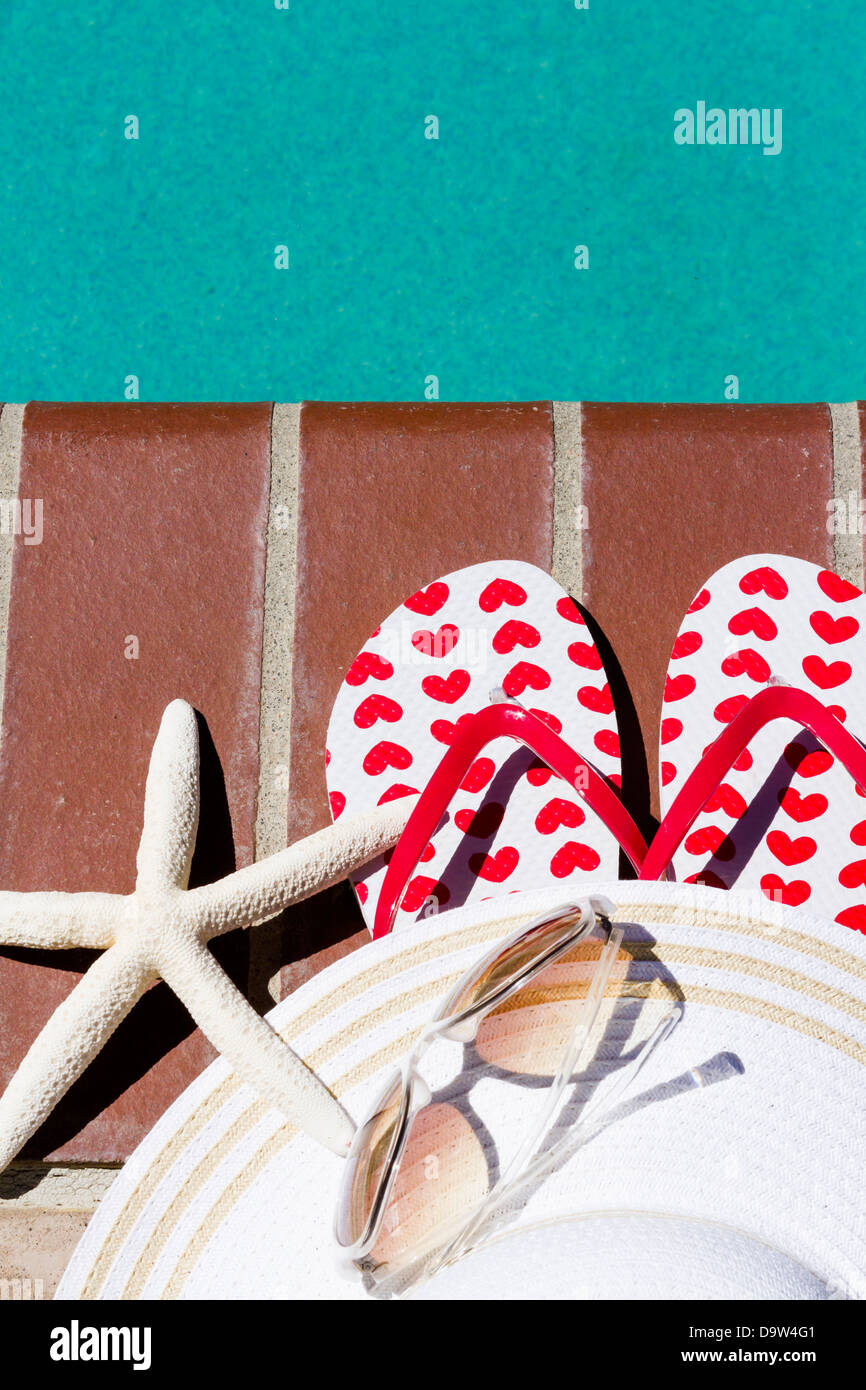 Colorful flip flops by a swimming pool Stock Photo - Alamy