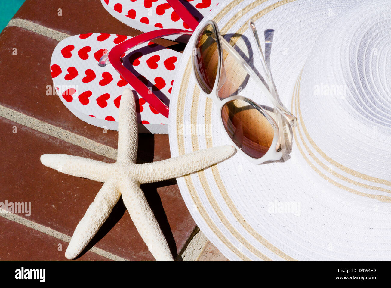 Colorful flip flops by a swimming pool Stock Photo - Alamy