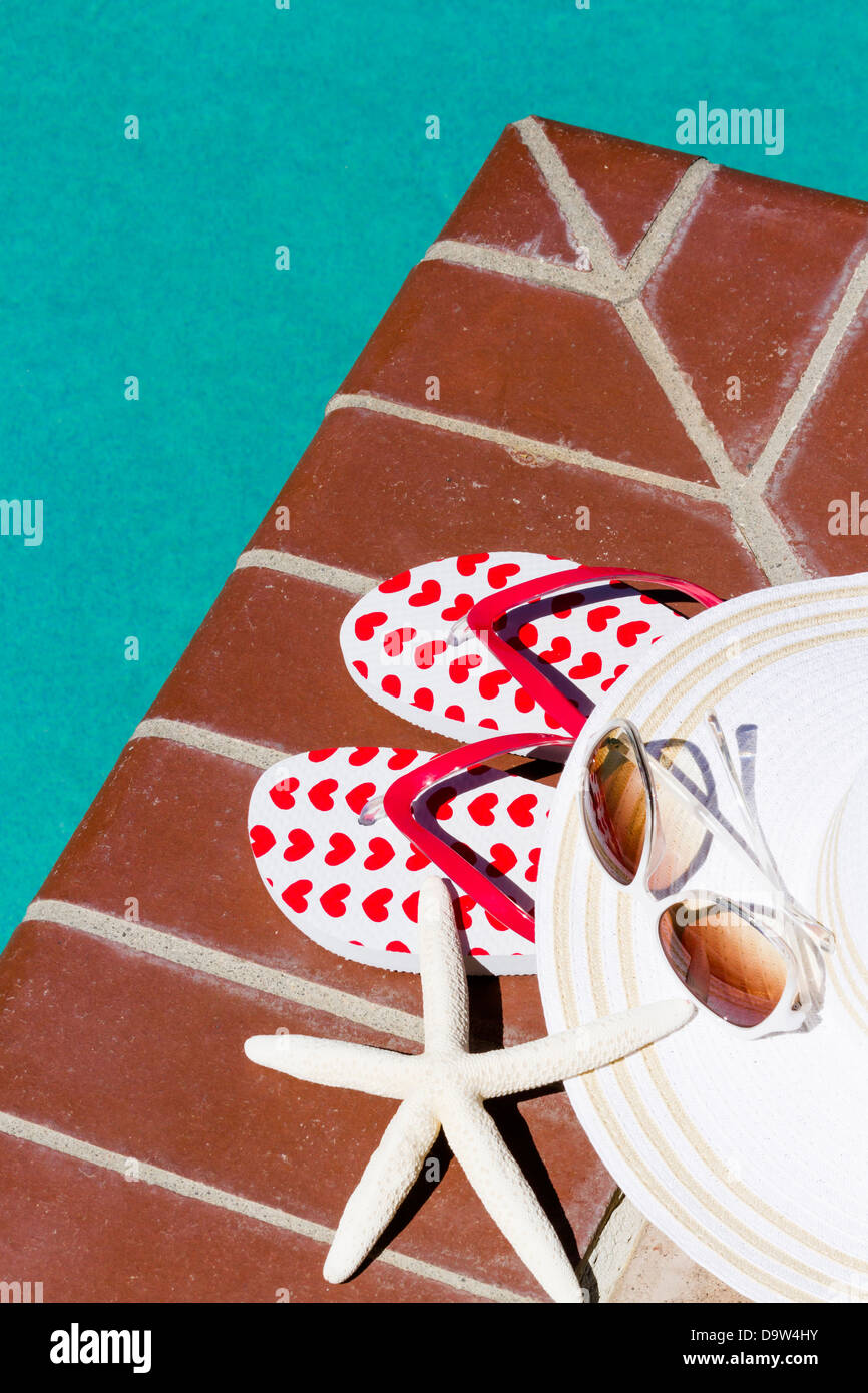 Colorful flip flops by a swimming pool Stock Photo - Alamy