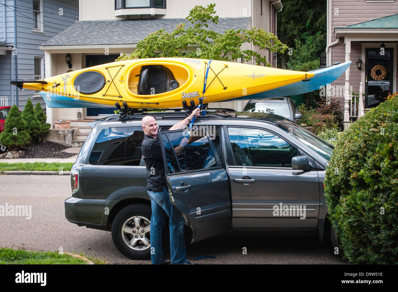 Kayak loading & preparation for holiday vacation getaway Stock Photo ...