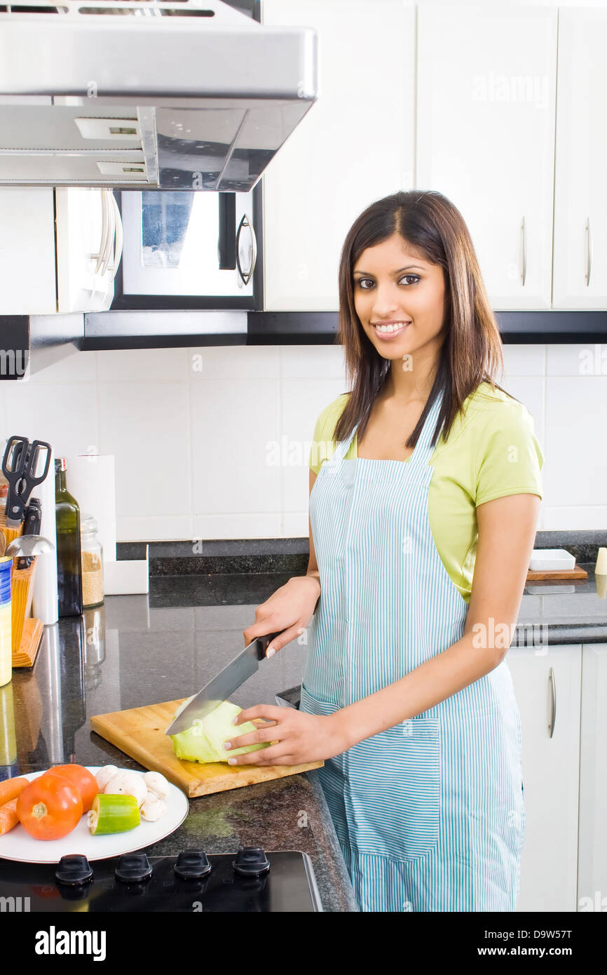 young pretty woman cooking in kitchen Stock Photo - Alamy