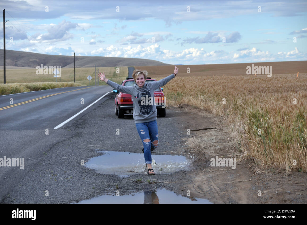 Women Running through puddle Stock Photo - Alamy