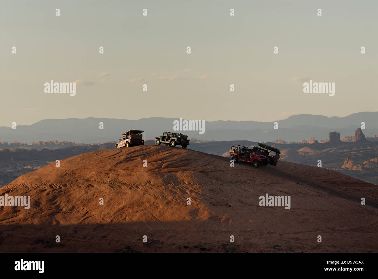 Hummer jeeps on a trail at sunset, Slickrock Trail, Moab, Utah, USA ...
