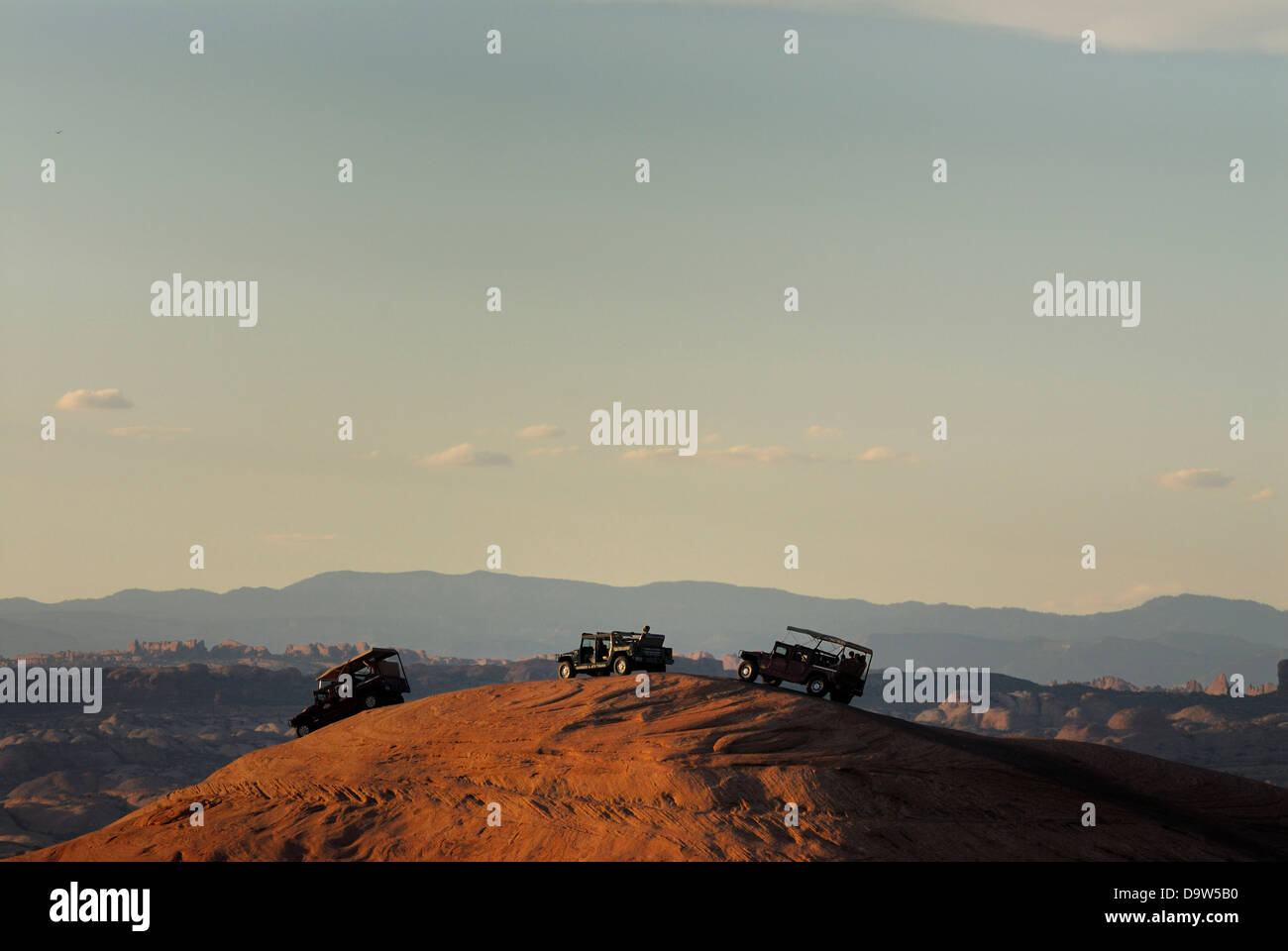 Hummer jeeps on a trail at sunset, Slickrock Trail, Moab, Utah, USA ...