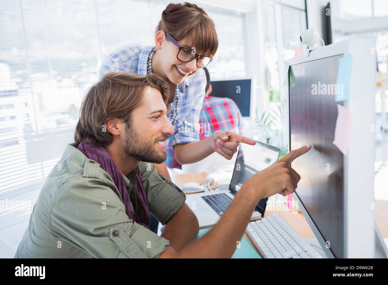 Pair of photo editors working together Stock Photo - Alamy