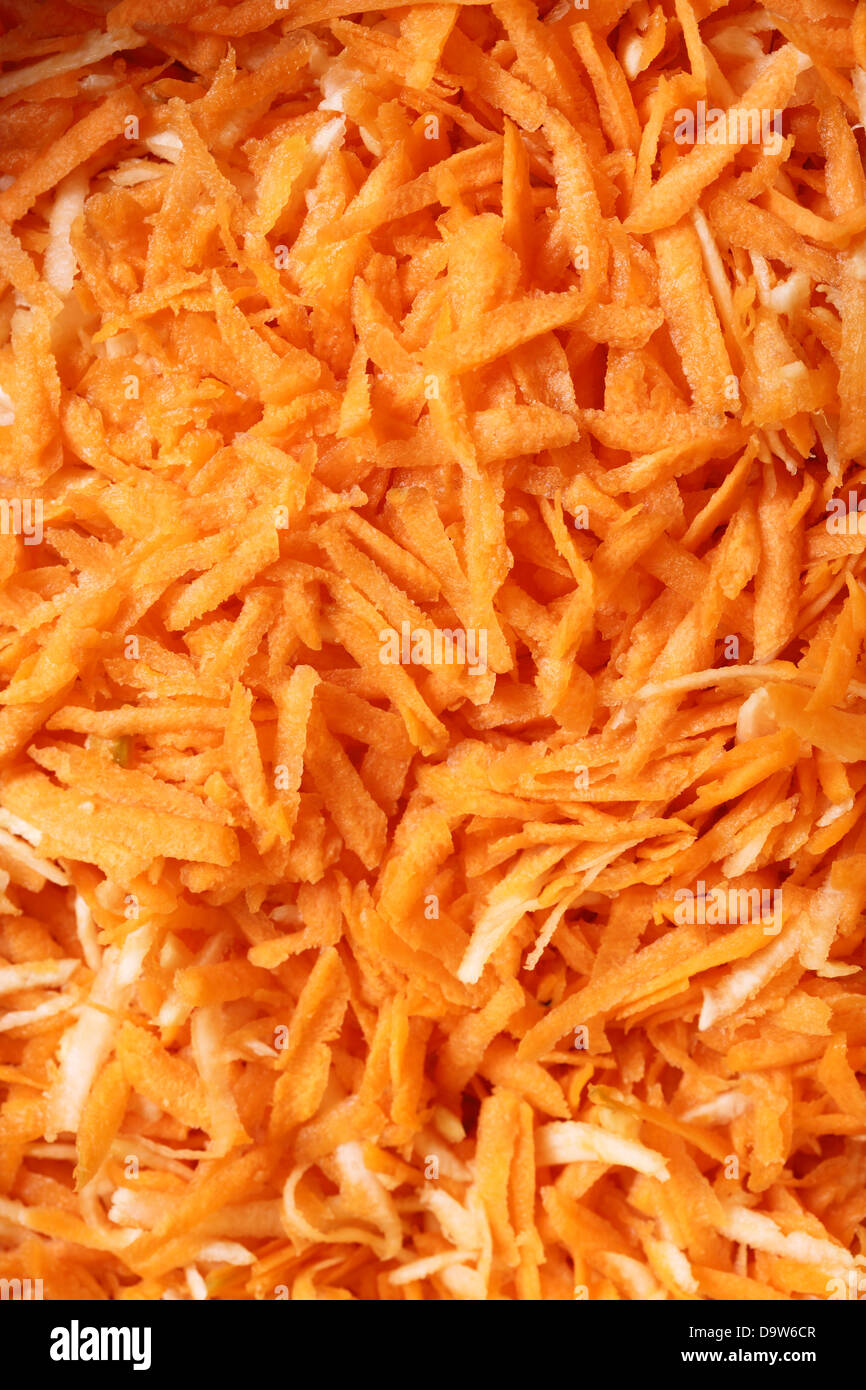 Close up grated carrots vegetables salad as background Stock Photo - Alamy