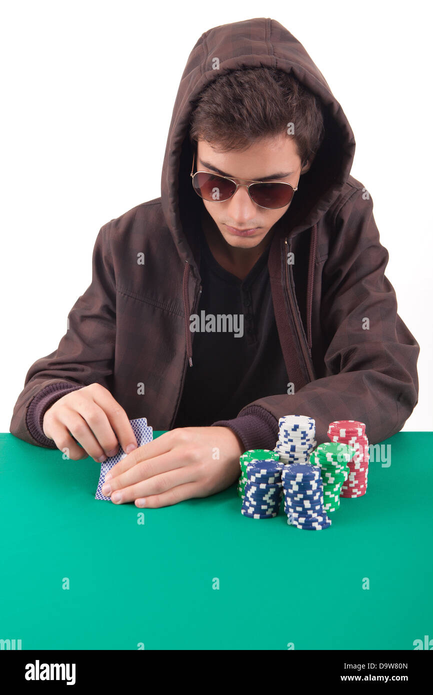 Young handsome man playing texas hold'em poker Stock Photo - Alamy