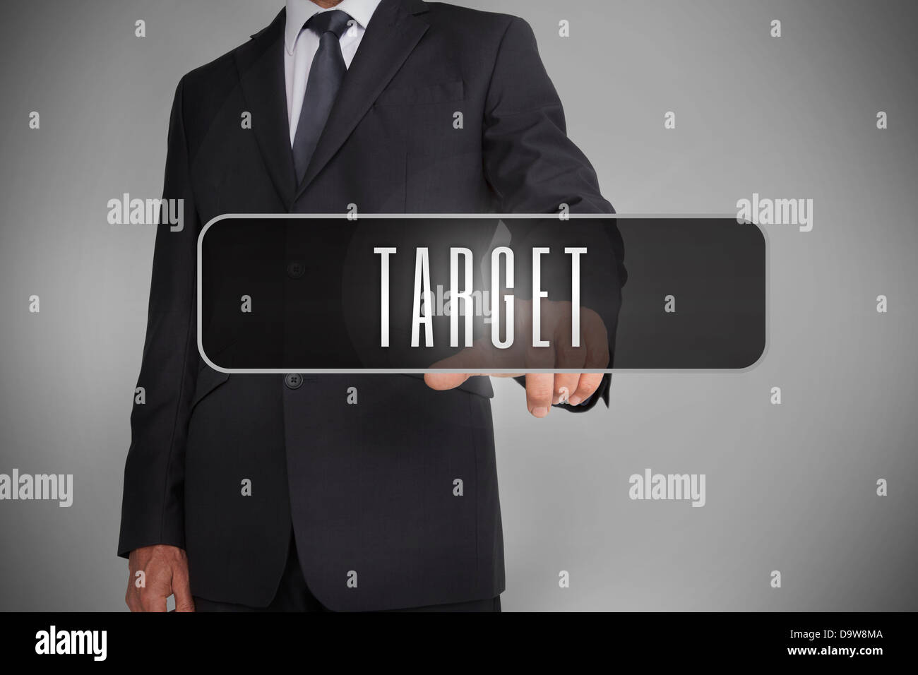 Businessman selecting label with target written on it Stock Photo - Alamy