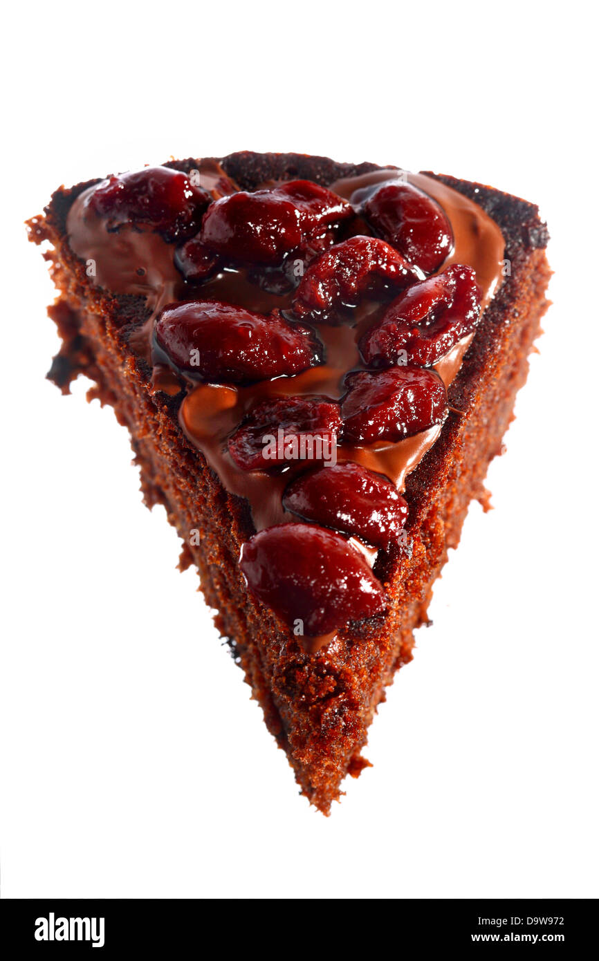 Piece of chocolate cake with icing and cherry on white background Stock ...
