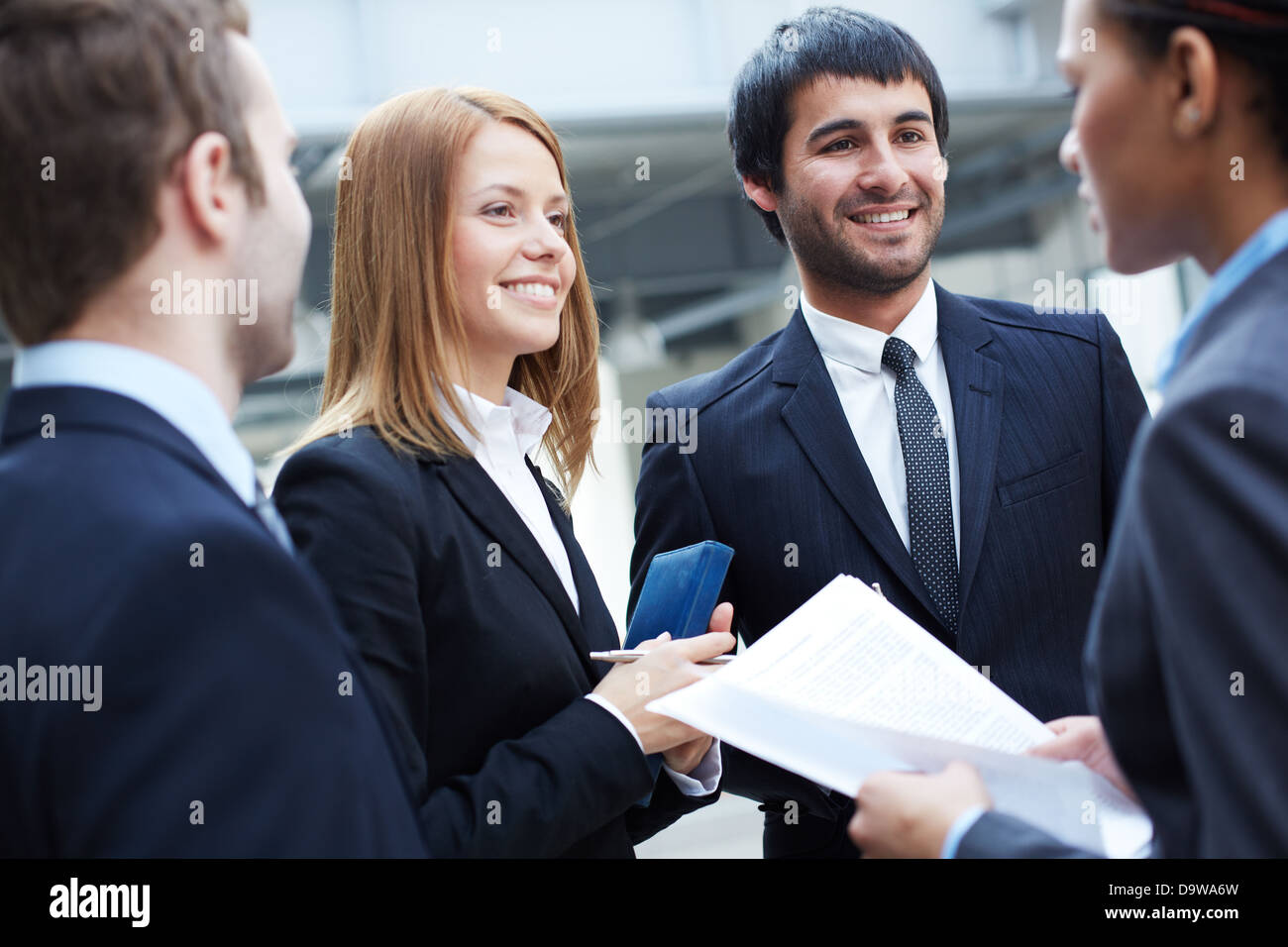 Group of business partners negotiating at meeting Stock Photo - Alamy