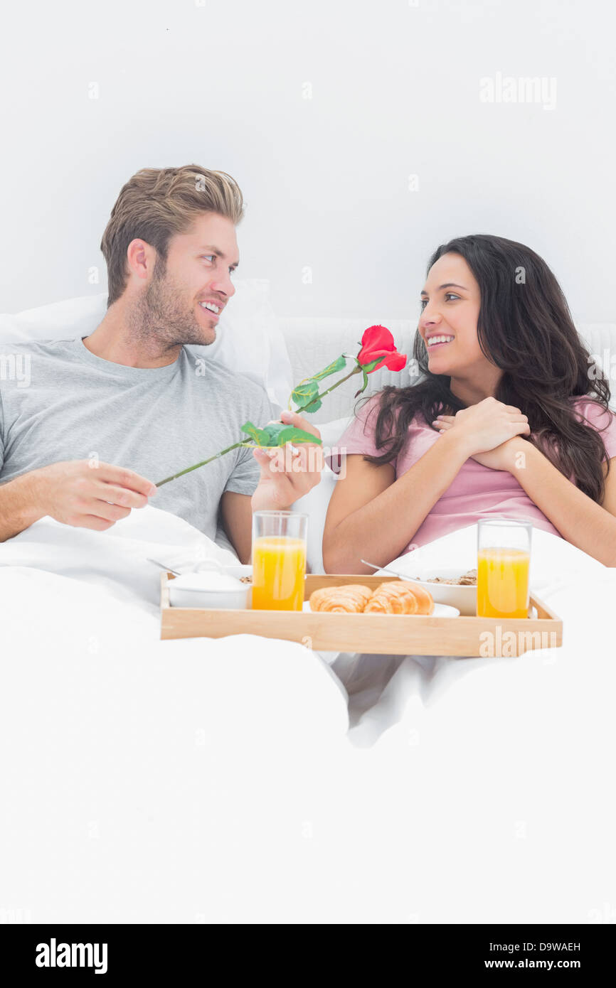Romantic young man giving rose hi-res stock photography and images - Alamy