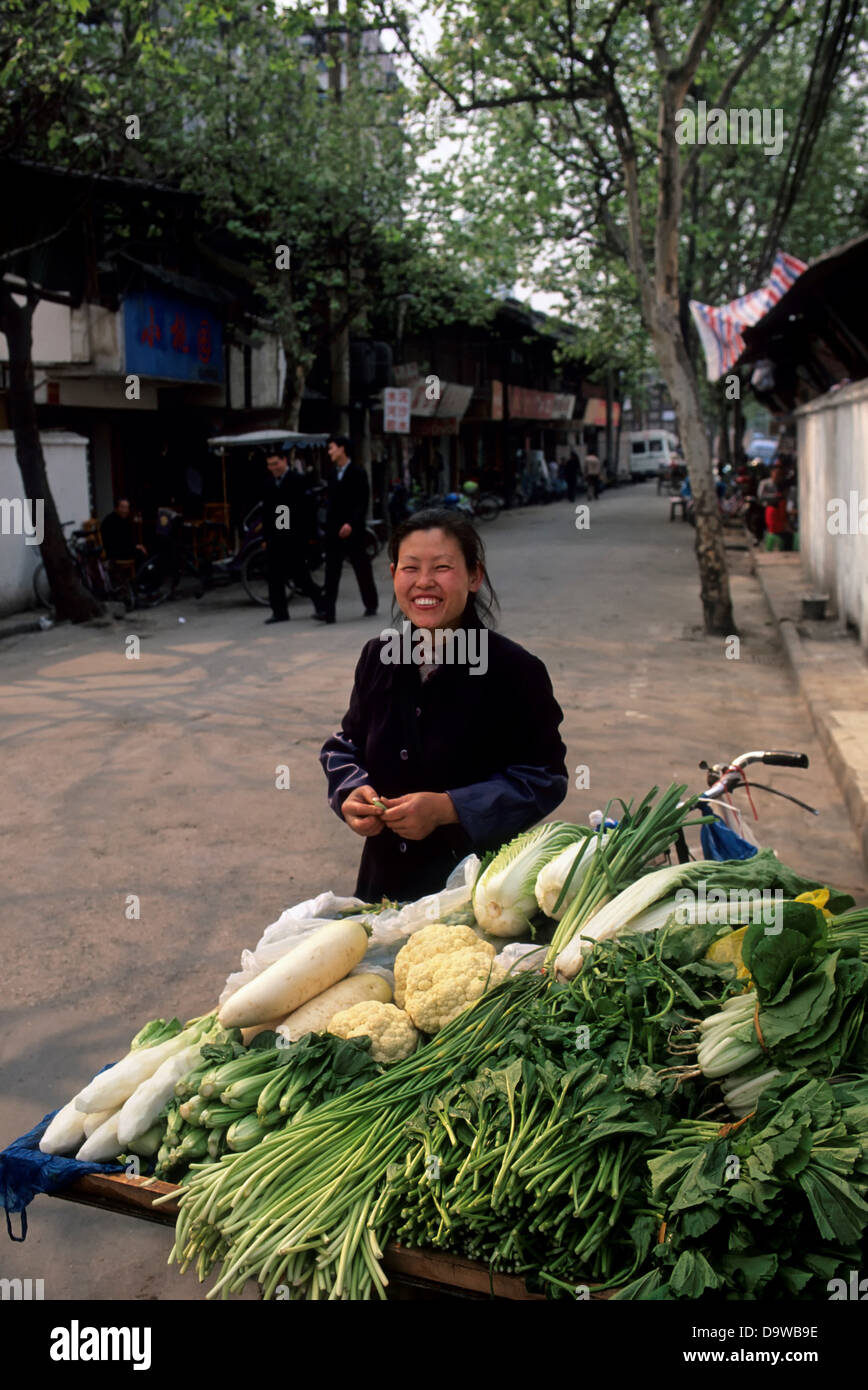 China, Sichuan Province, Chengdu, Street Scene, Woman Selling ...