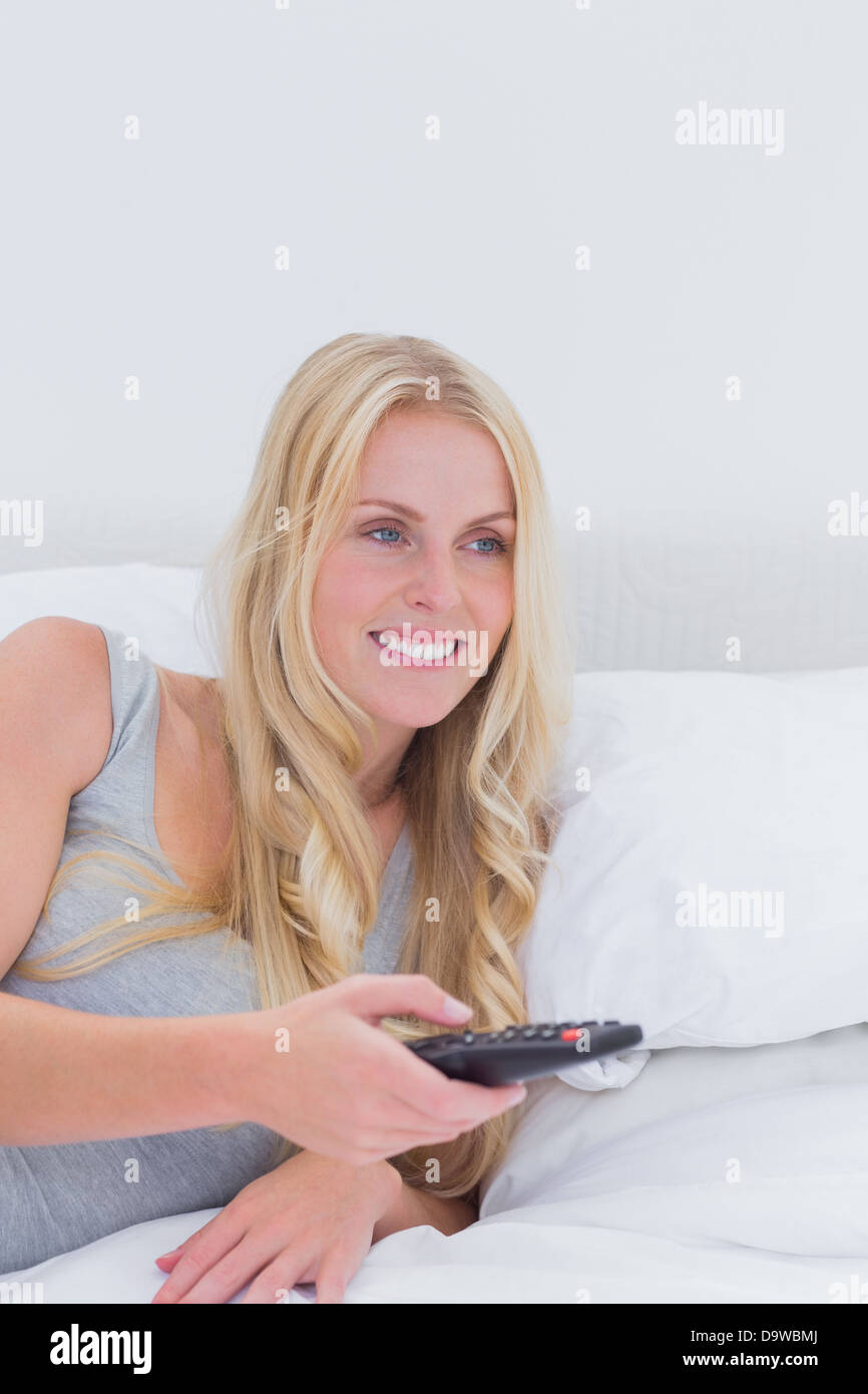 Pretty woman watching TV Stock Photo - Alamy