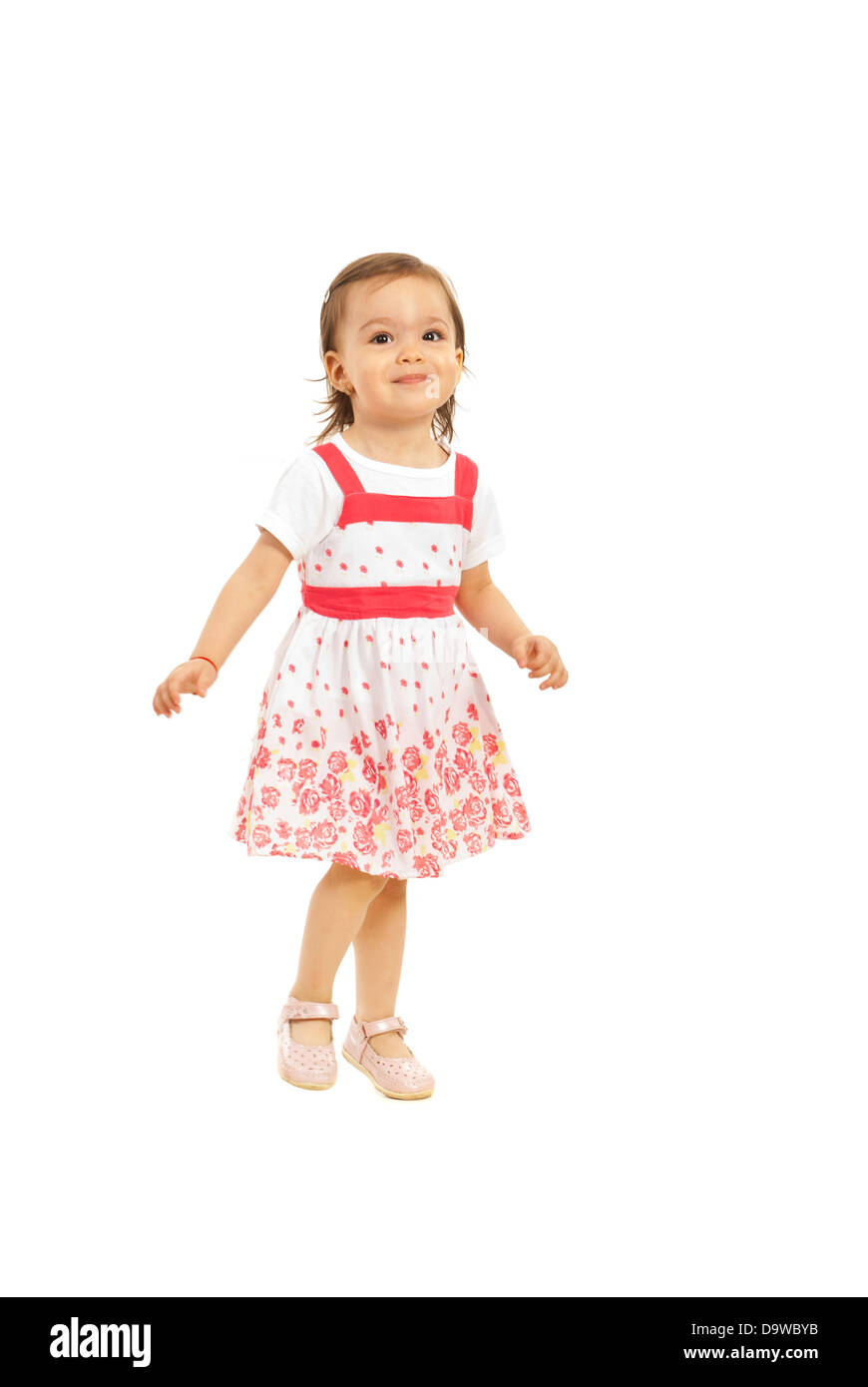 Happy toddler girl in beautiful dress posing isolated on white ...