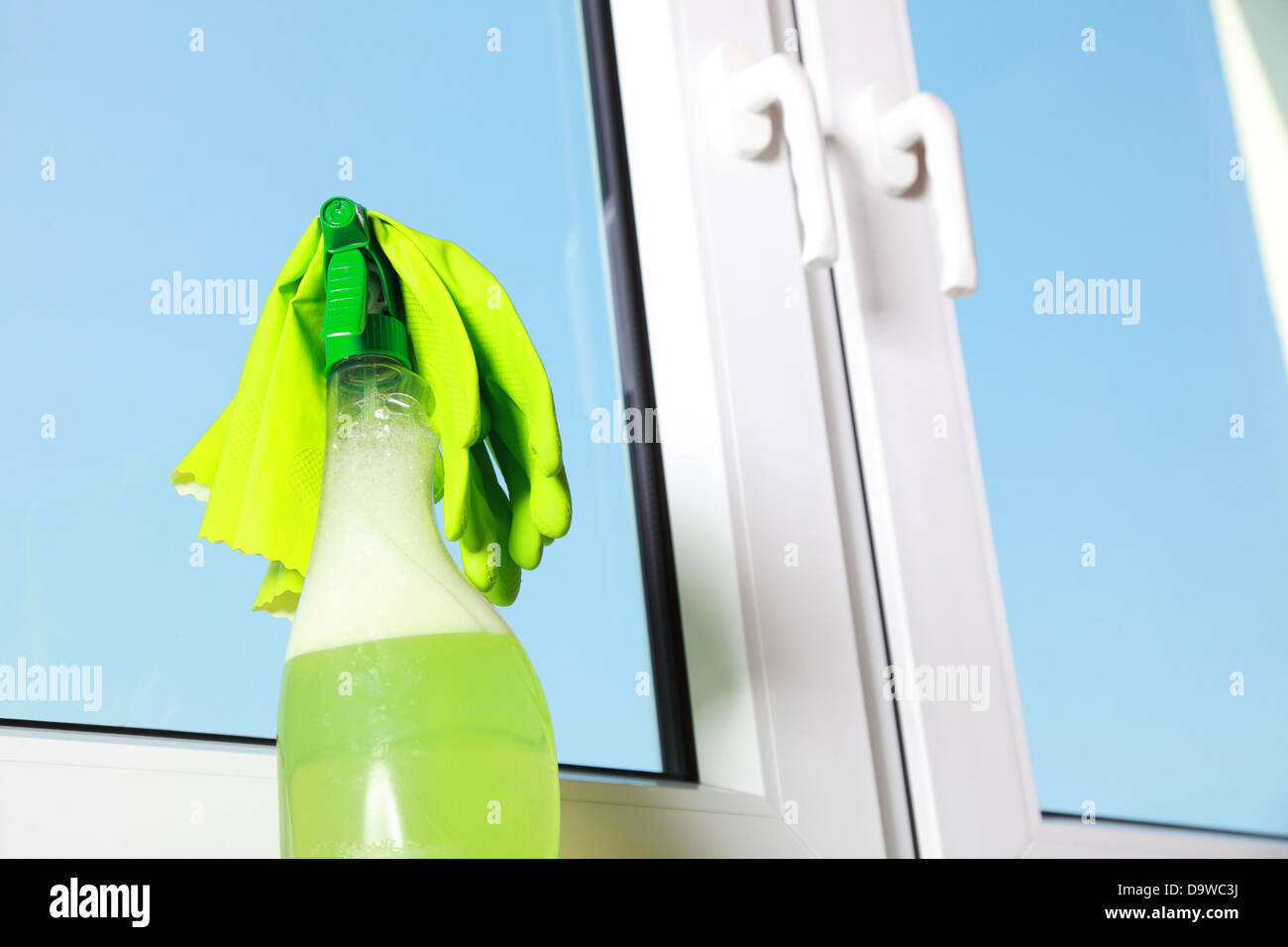 Cleaning window using tools - rag and spray detergent. Spring cleaning ...