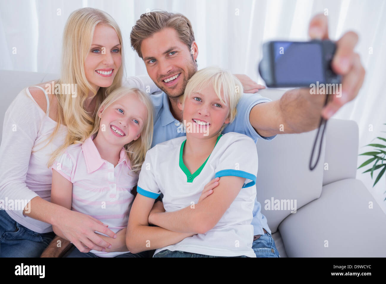 Family taking pictures Stock Photo - Alamy