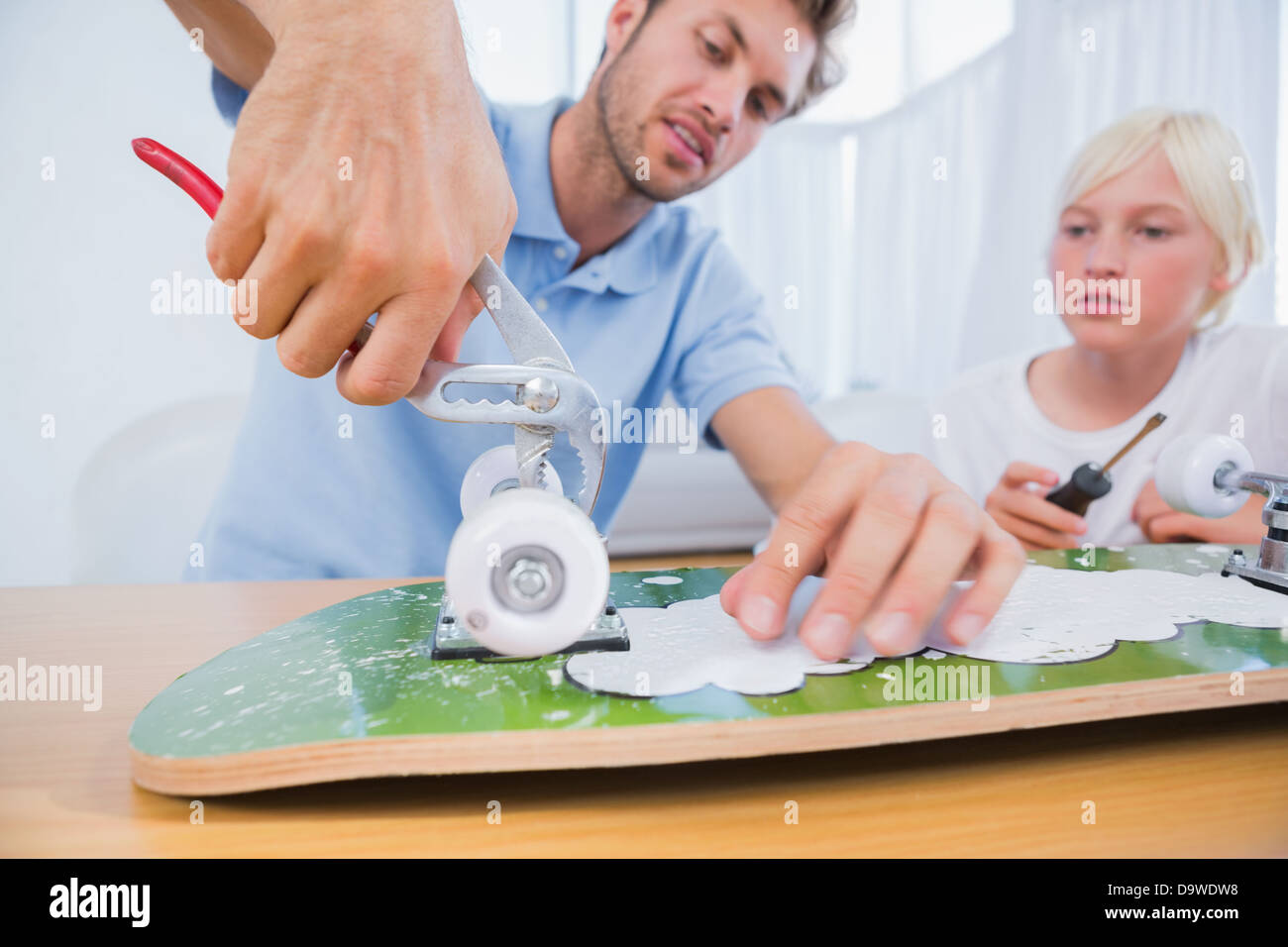 Father son fixing table hi-res stock photography and images - Alamy