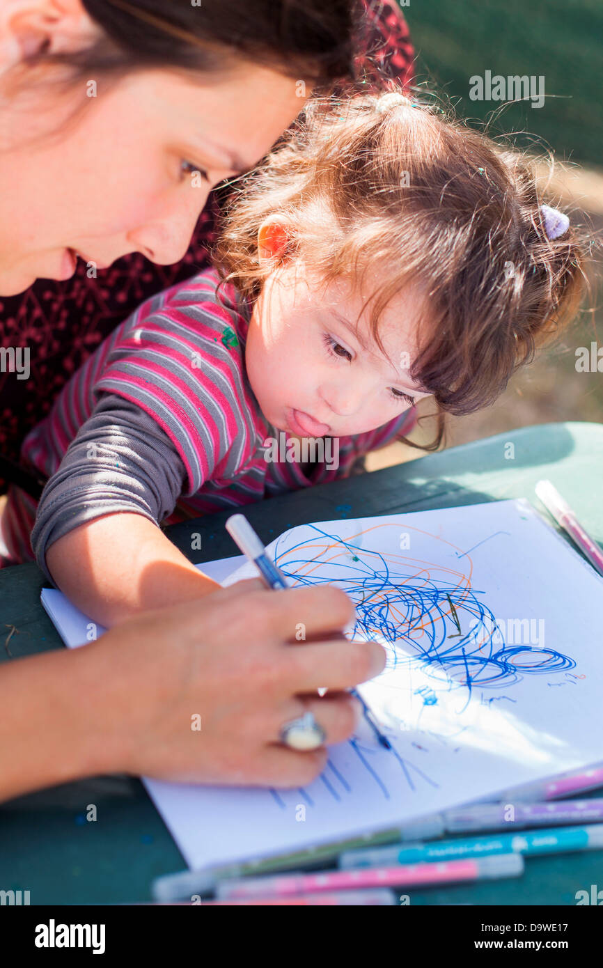 2 and a half year old girl with Down's syndrome with her mother Stock ...