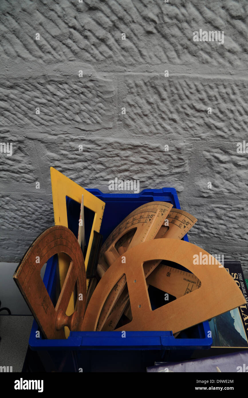 A collection of wooden angle and set squares used for maths in a school ...