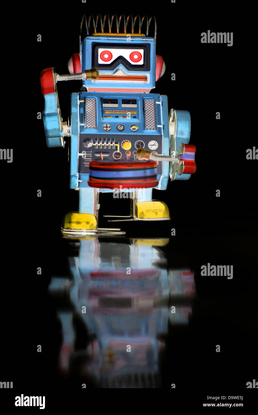 retro robot toy and reflection Stock Photo - Alamy