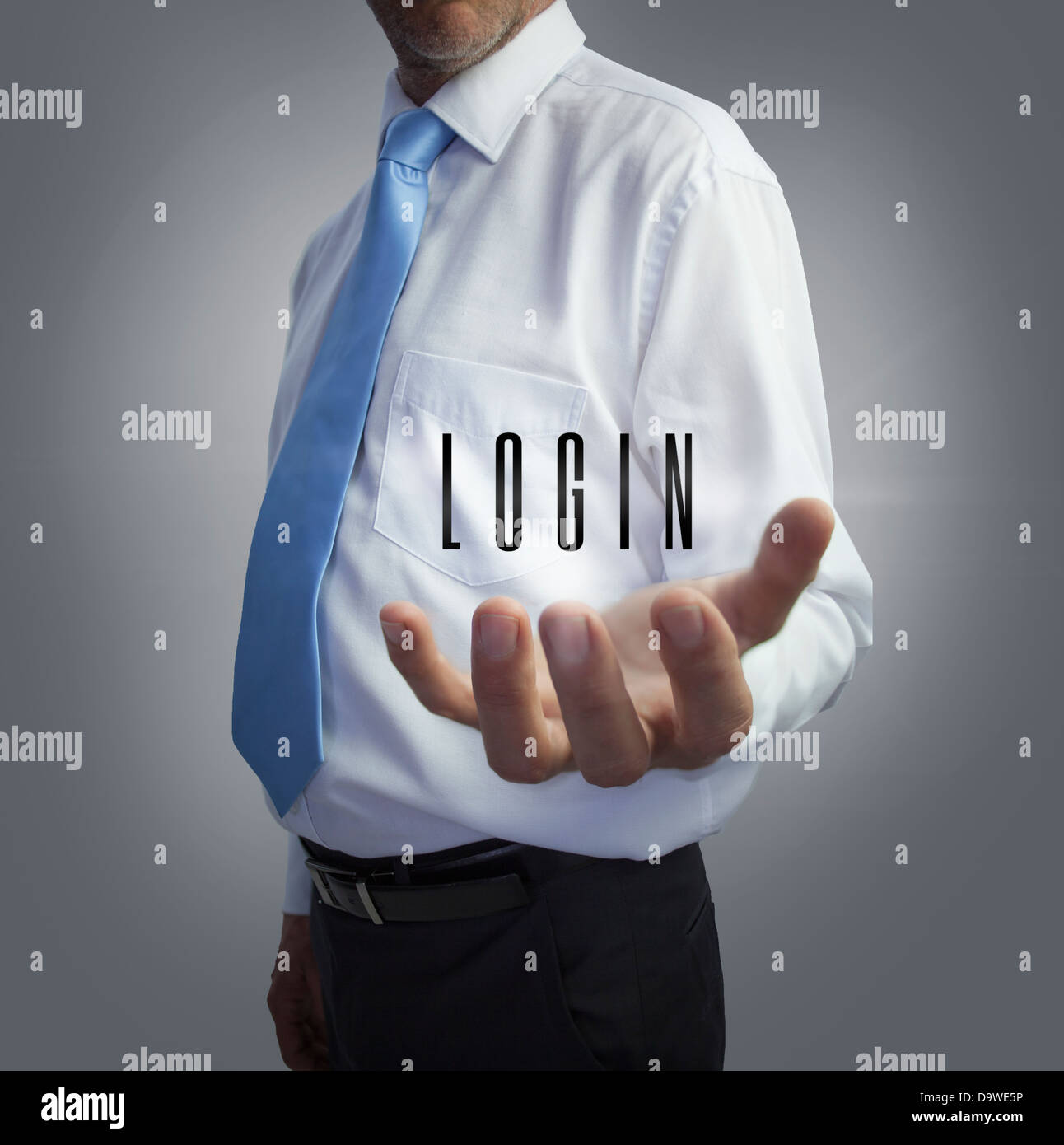 Businessman holding the word login Stock Photo - Alamy