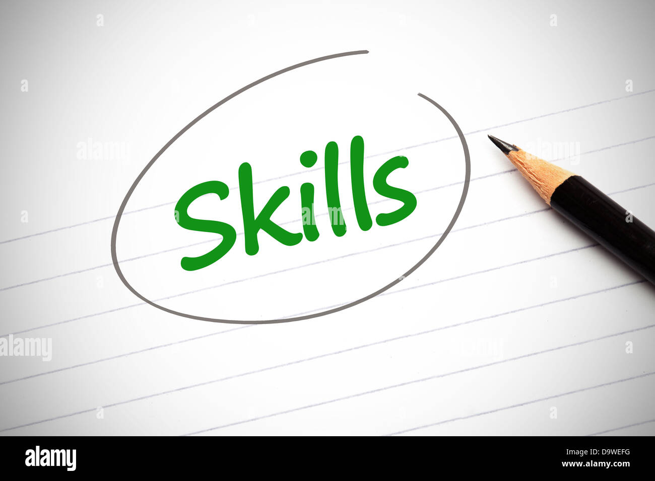 Skills word written in green on a notepad Stock Photo - Alamy