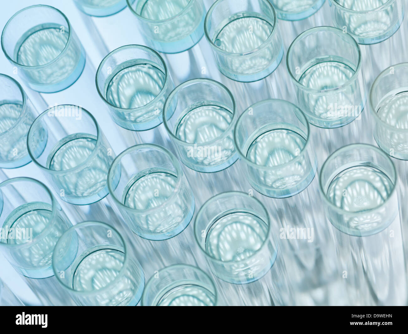 Upper view, macro of transparent glass labware with floating colorless ...