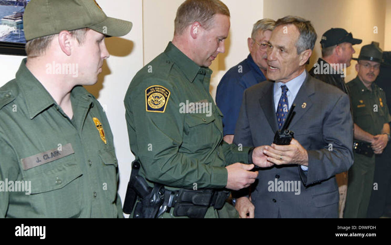 This image depicts a U.S. Customs and Border Protection (CBP) team ...