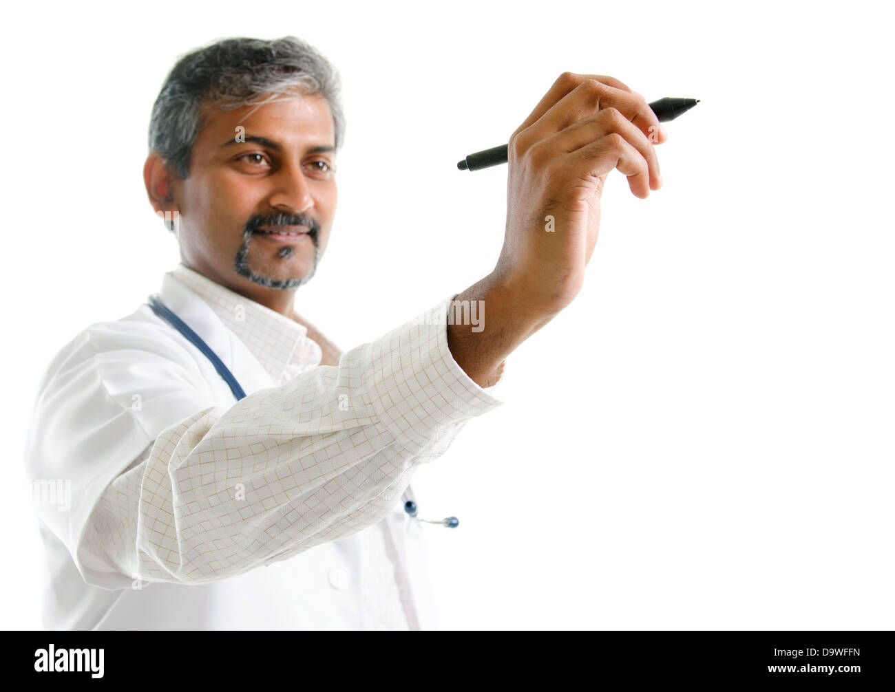 Indian doctor writing. Mature Indian male medical doctor drawing or ...
