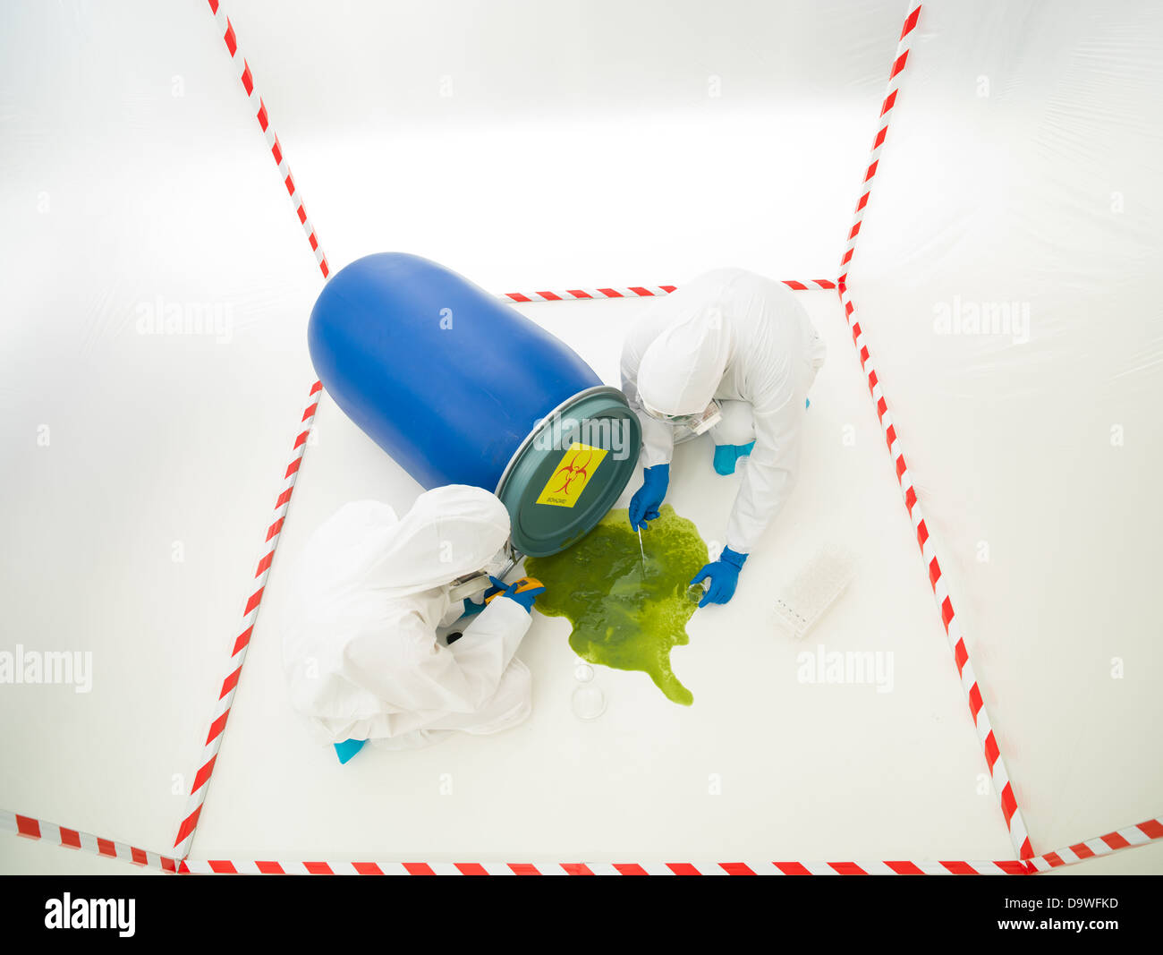 upper view of two specialists measuring the level of contamination of a ...