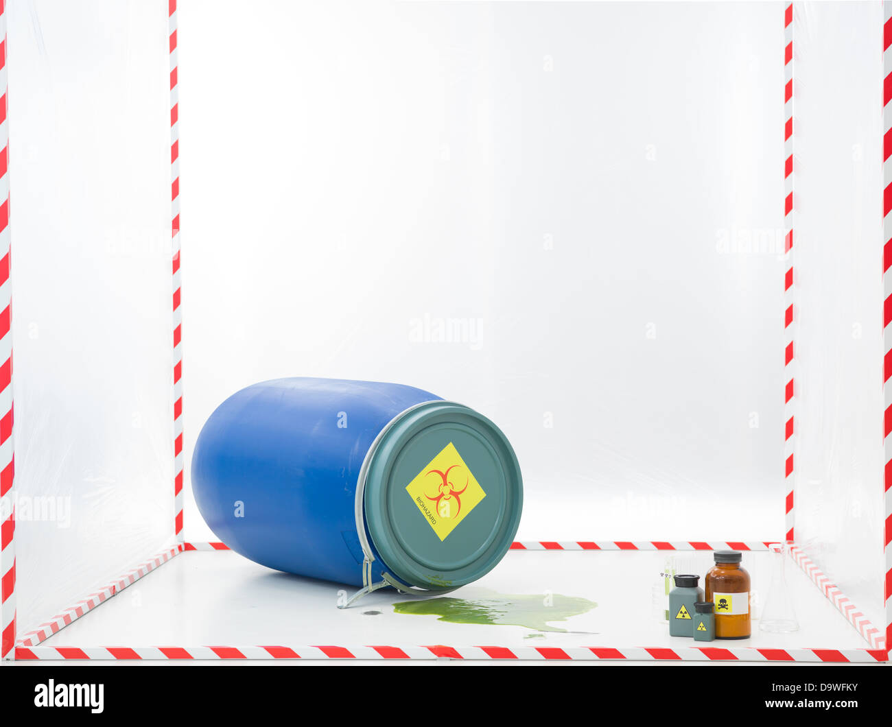 blue barrel with biohazard label and a puddle of green liquid in a cube ...