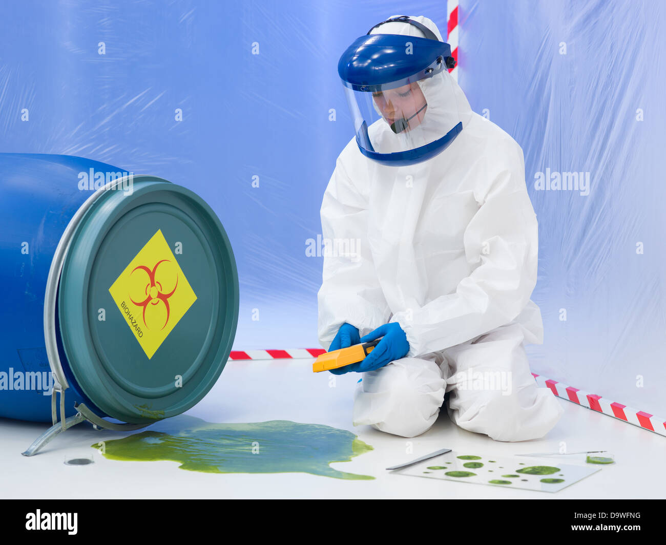 close-up of female scientist wearing white protection suit and mask ...