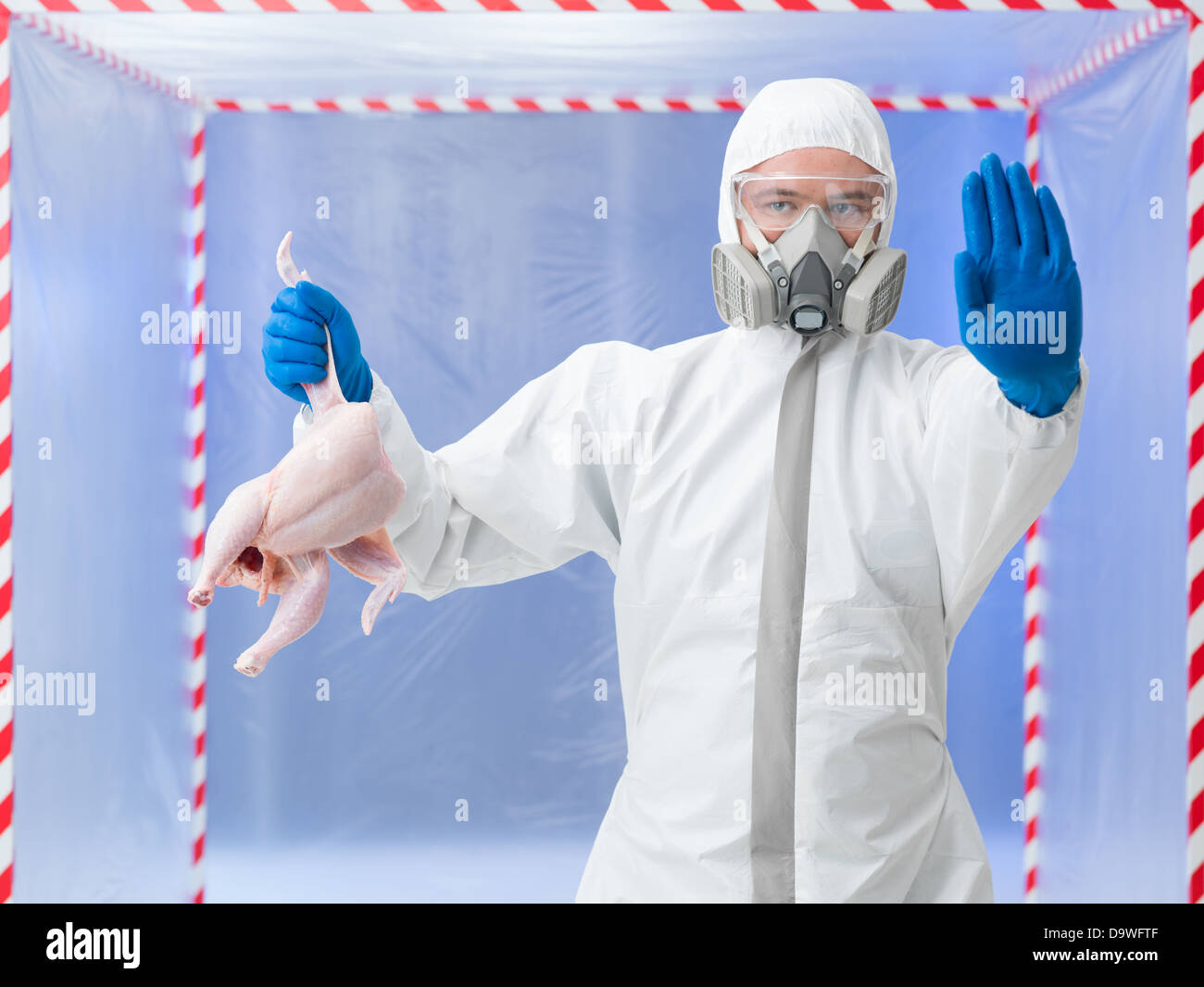 Biohazard technician in a full biohazard suit and breathing apparatus ...