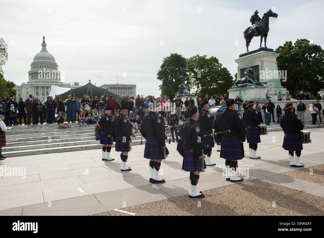 This image depicts a performance by the OFO Pipes & Drum, part of the U ...