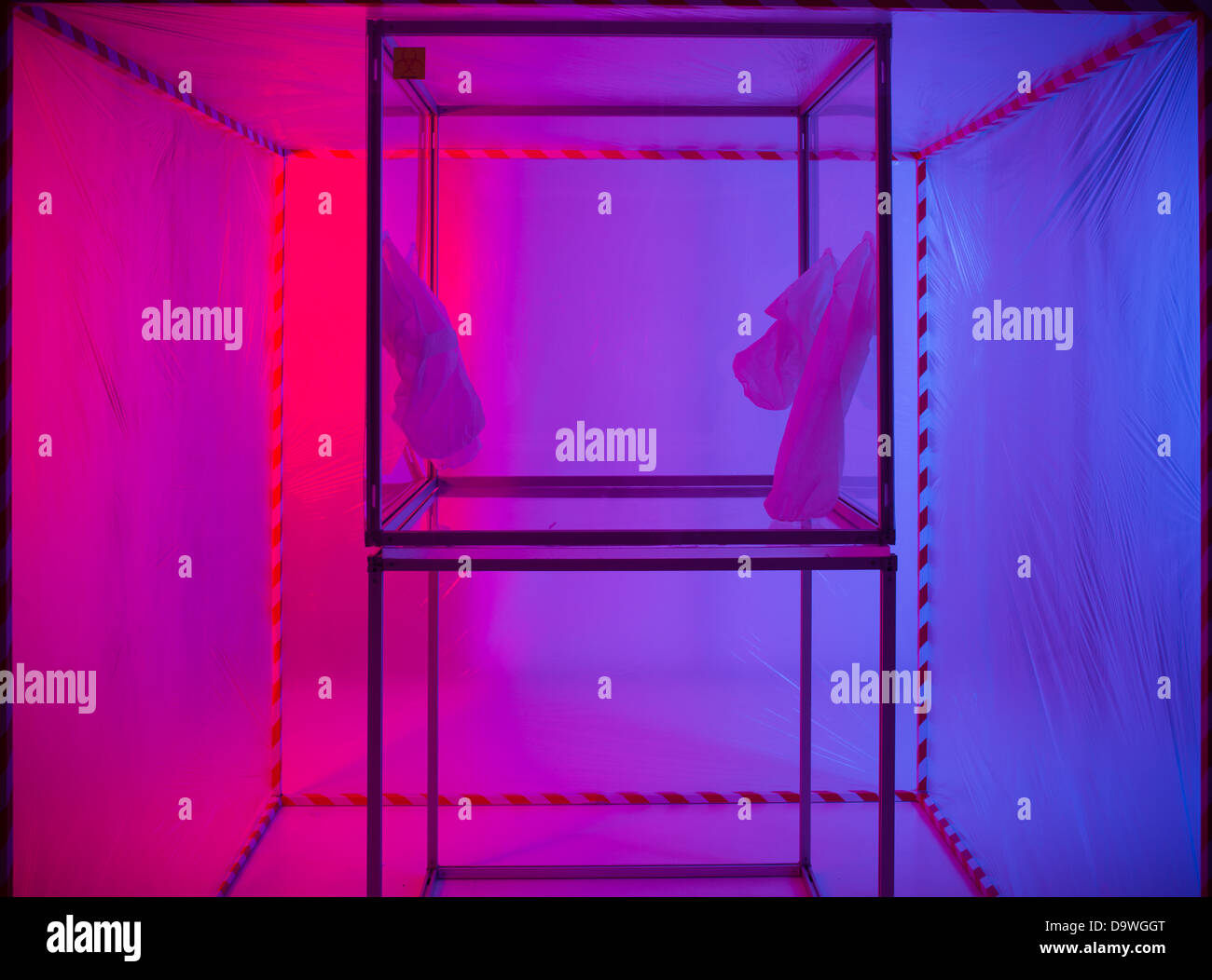sterile chamber in a containment tent with a purple and blue background ...