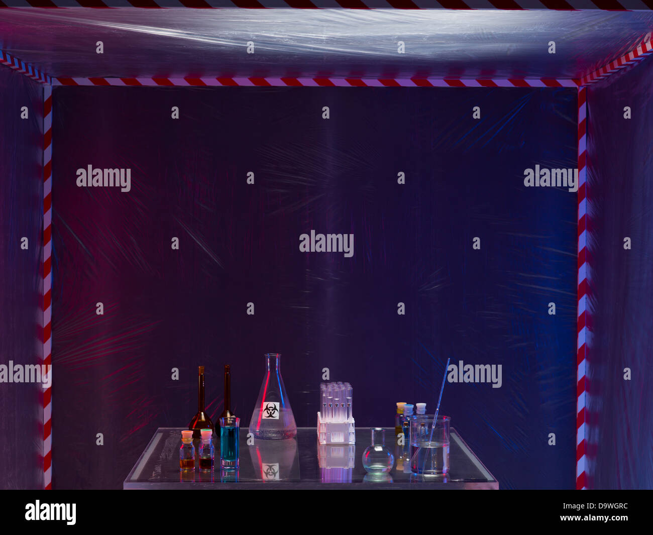 different glass containers filled with differently colored liquids on a ...