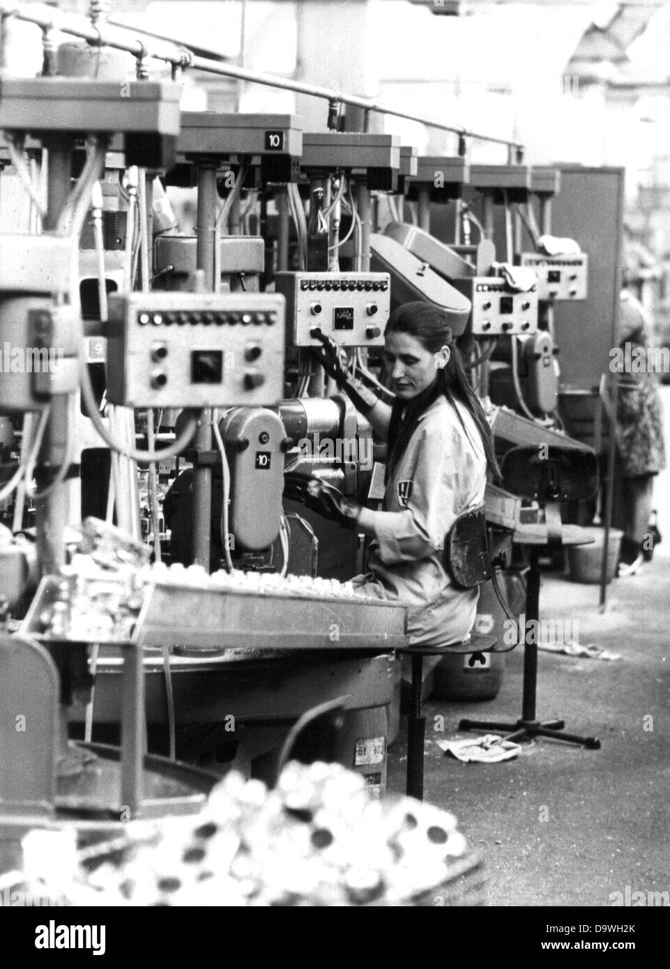 A worker at her assembly line work place (picture from 1973 Stock Photo ...