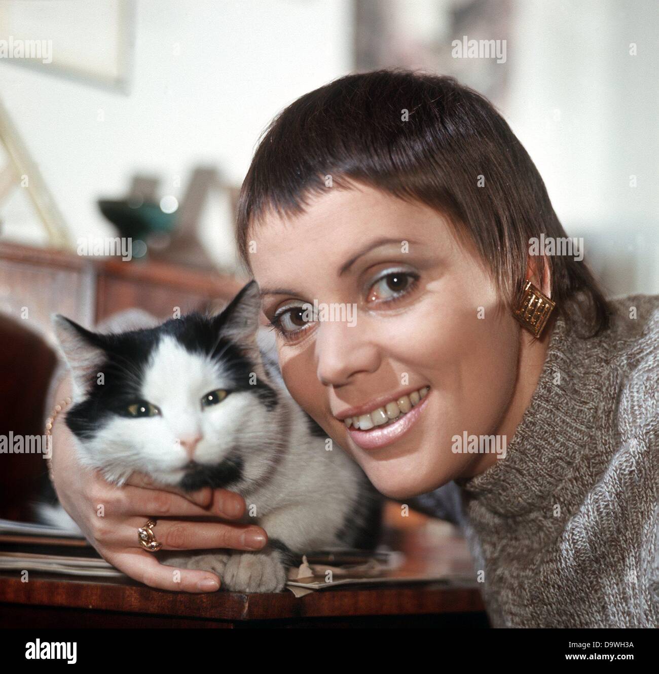German opera singer Brigitte Fassbaender with her cat in her apartment ...