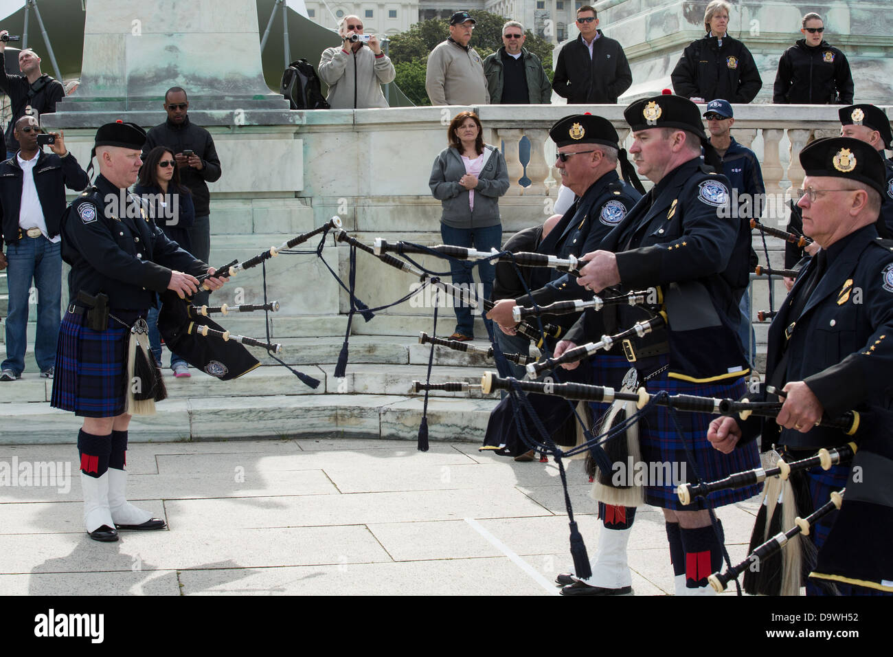 This photograph captures the OFO Pipes & Drum performing during a U.S ...