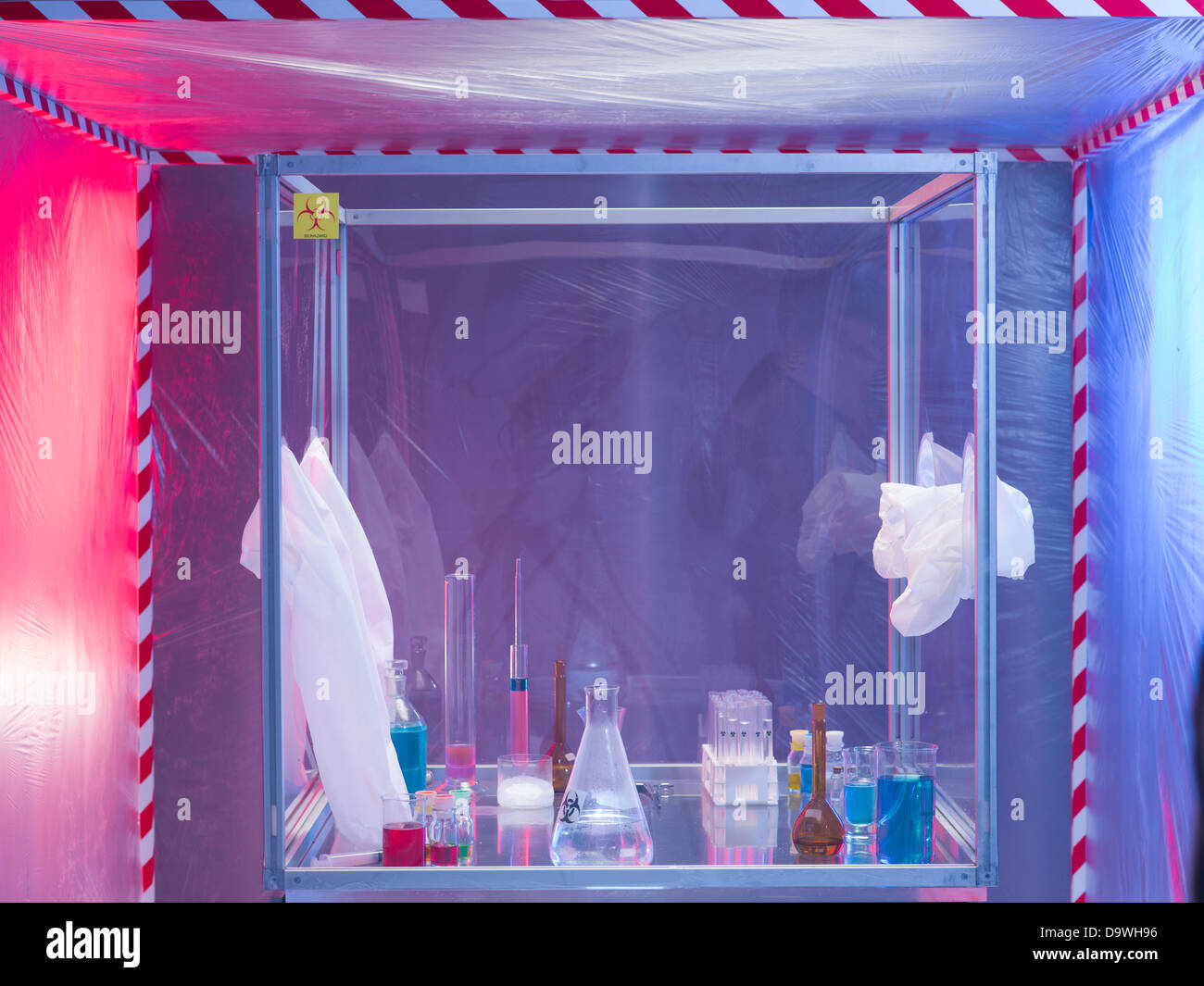 different glass containers filled with differently colored liquids in a ...