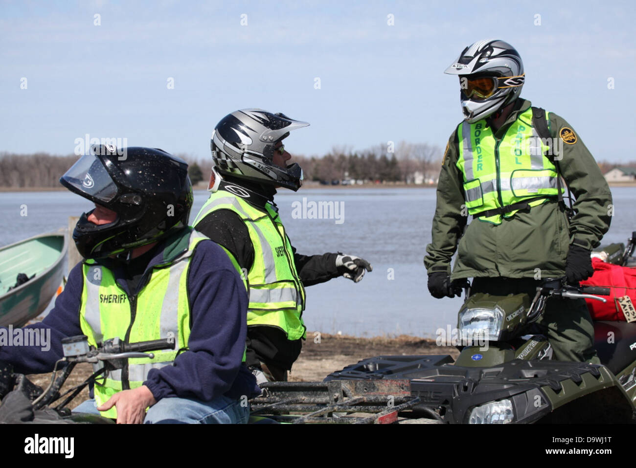 This image shows U.S. Customs and Border Protection officers using ATVs ...