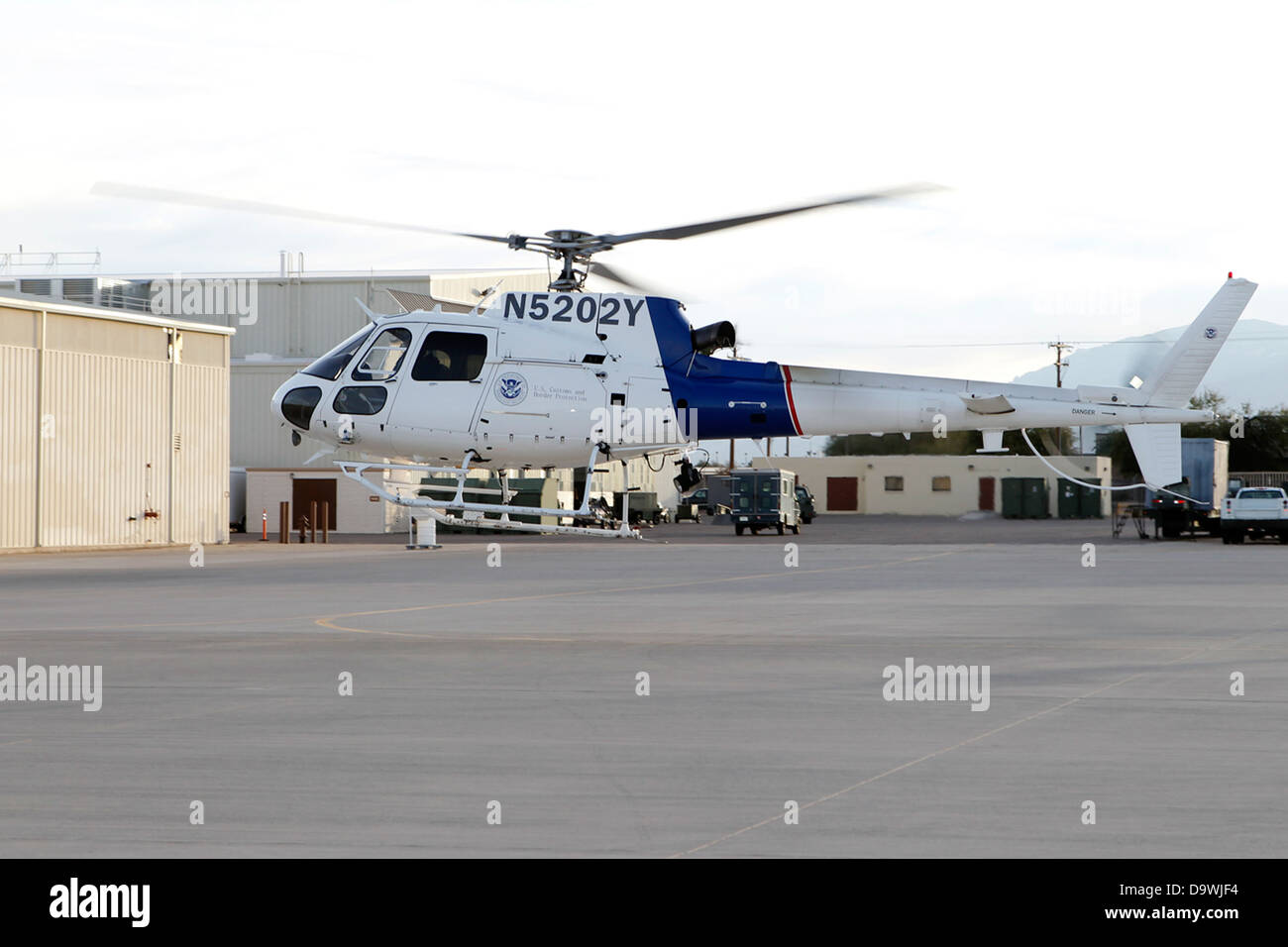 A U.S. Customs & Border Protection AStar helicopter patrols the ...