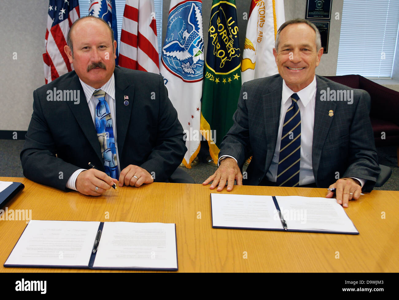U.S. Customs and Border Protection Commissioner Alan D. Bersin signs an ...