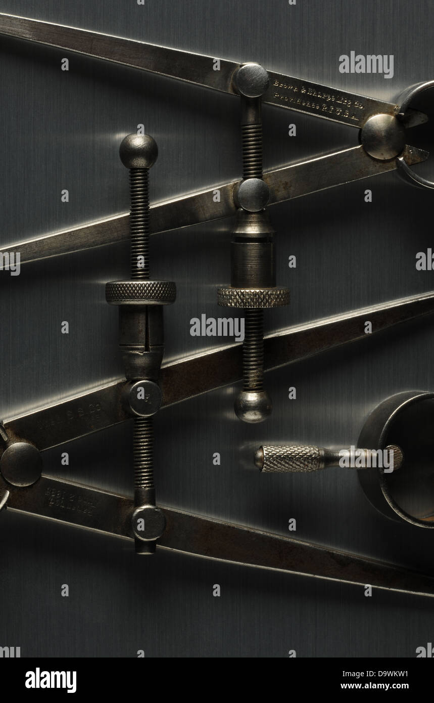 Detail of old steel, screw adjustable steel dividers and calipers Stock ...
