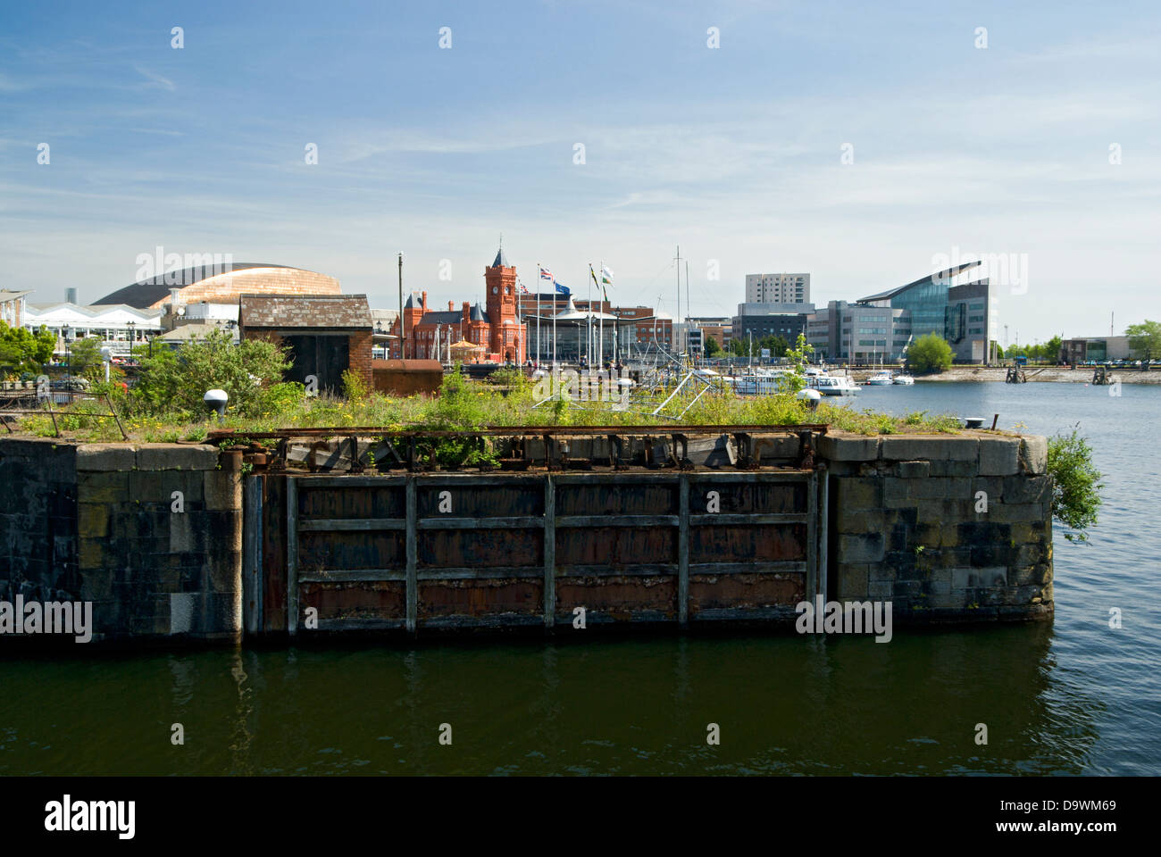 old rusted lock gates with the victorian pierhead building in the ...