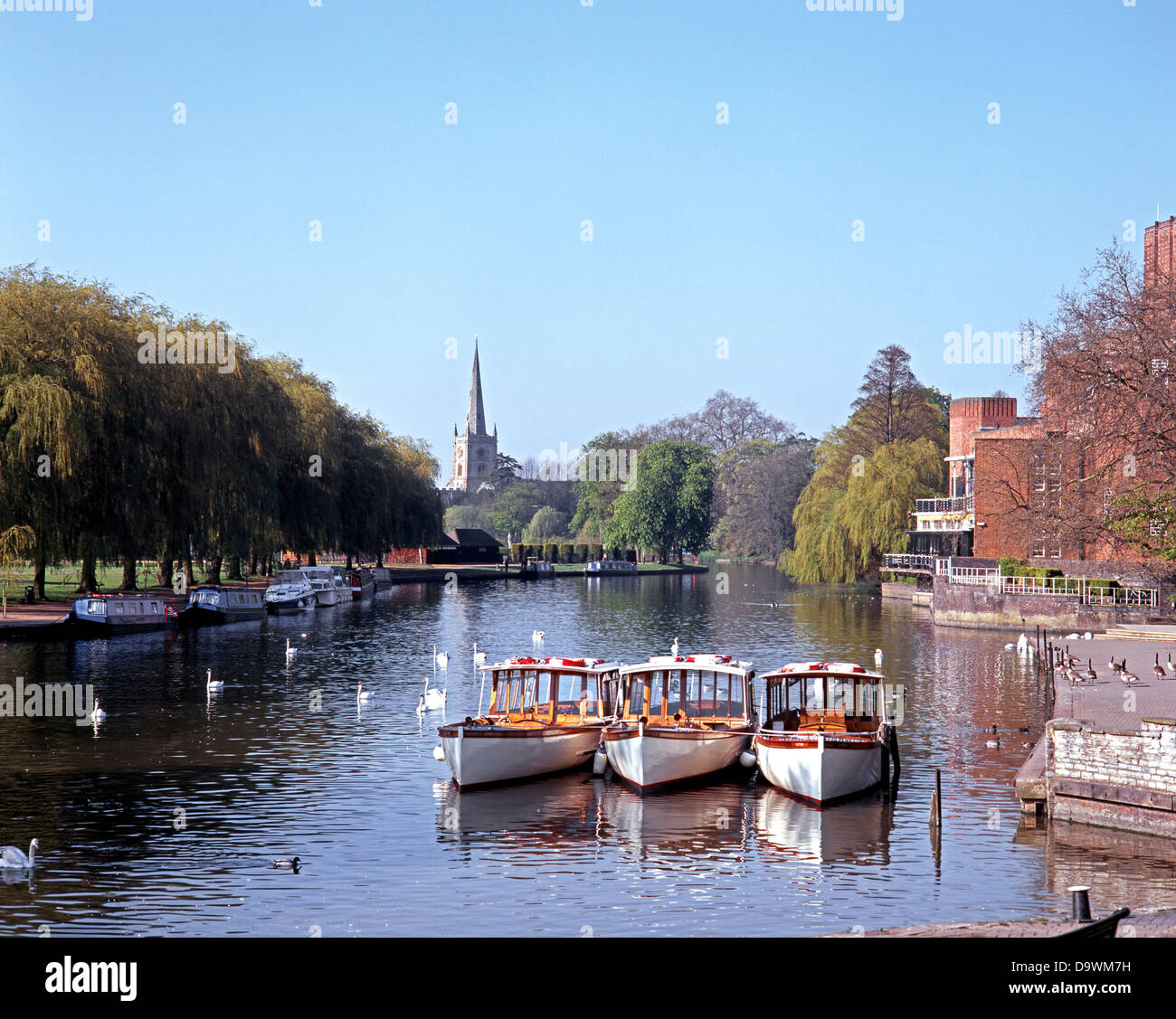 River Avon with pleasure boats moored and Church to rear, Stratford ...