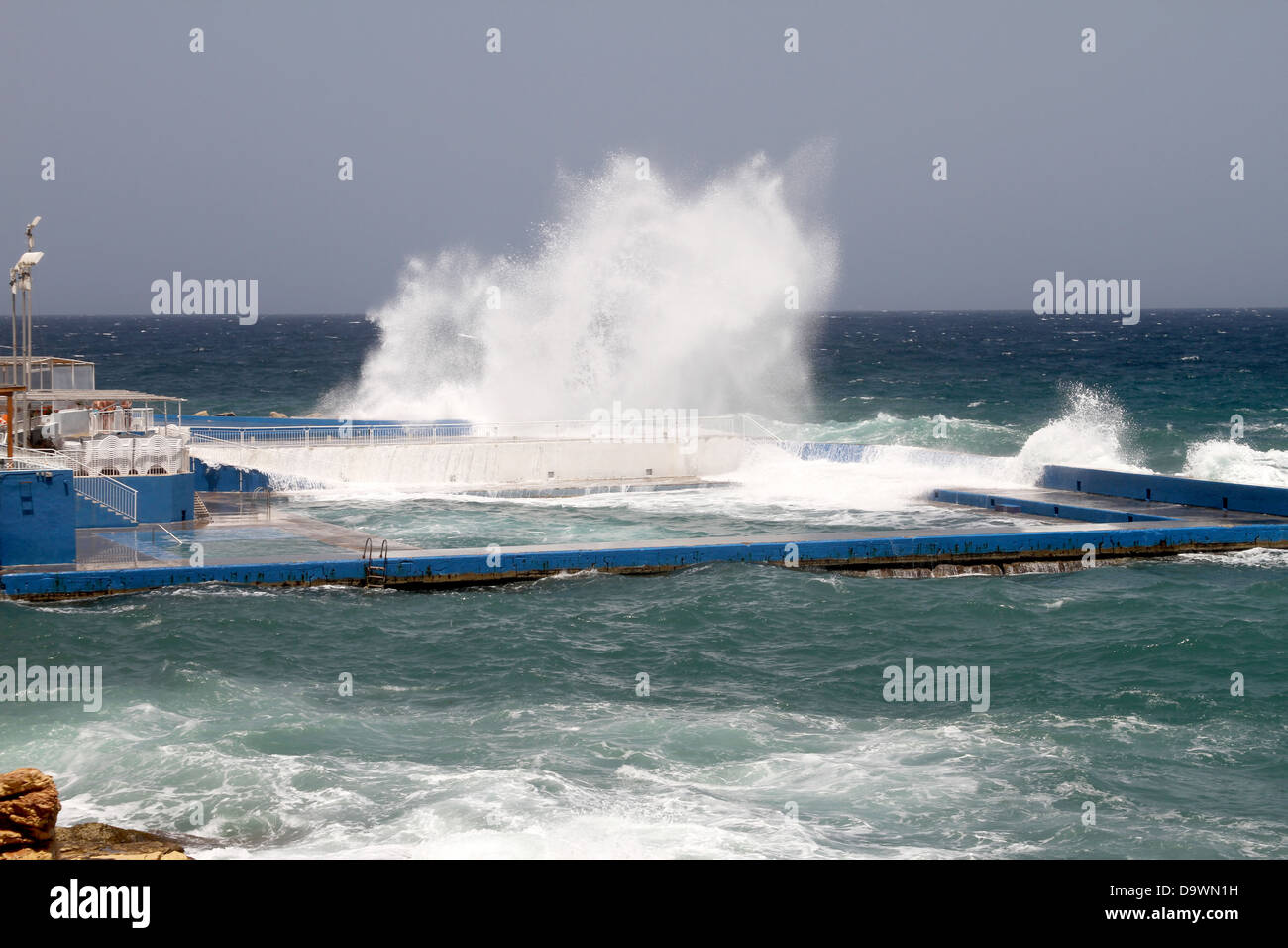 Huge waves getting into the swimming pool Stock Photo - Alamy
