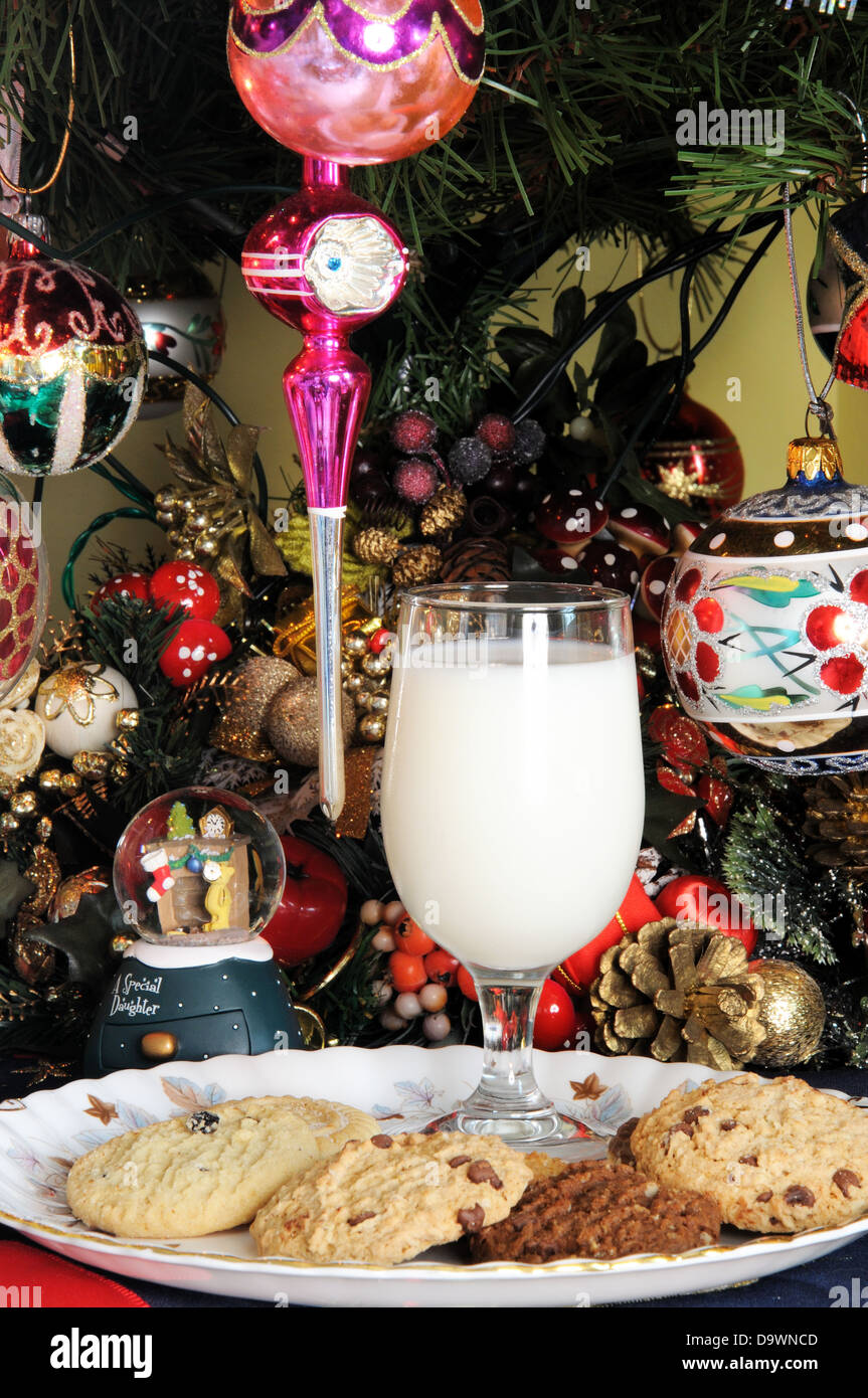 Milk and cookies under Christmas tree Stock Photo - Alamy