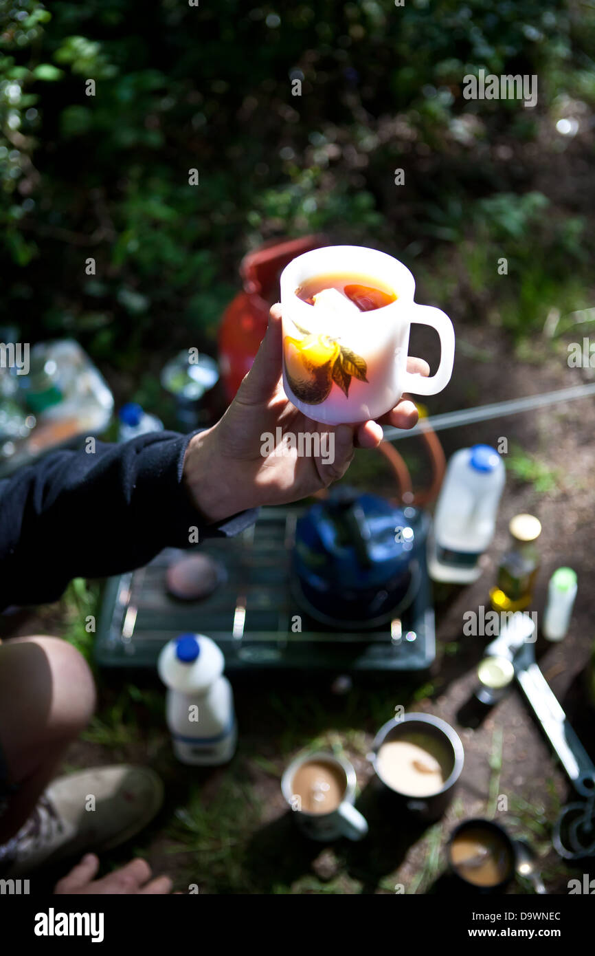 Making tea and coffee at campsite Stock Photo - Alamy