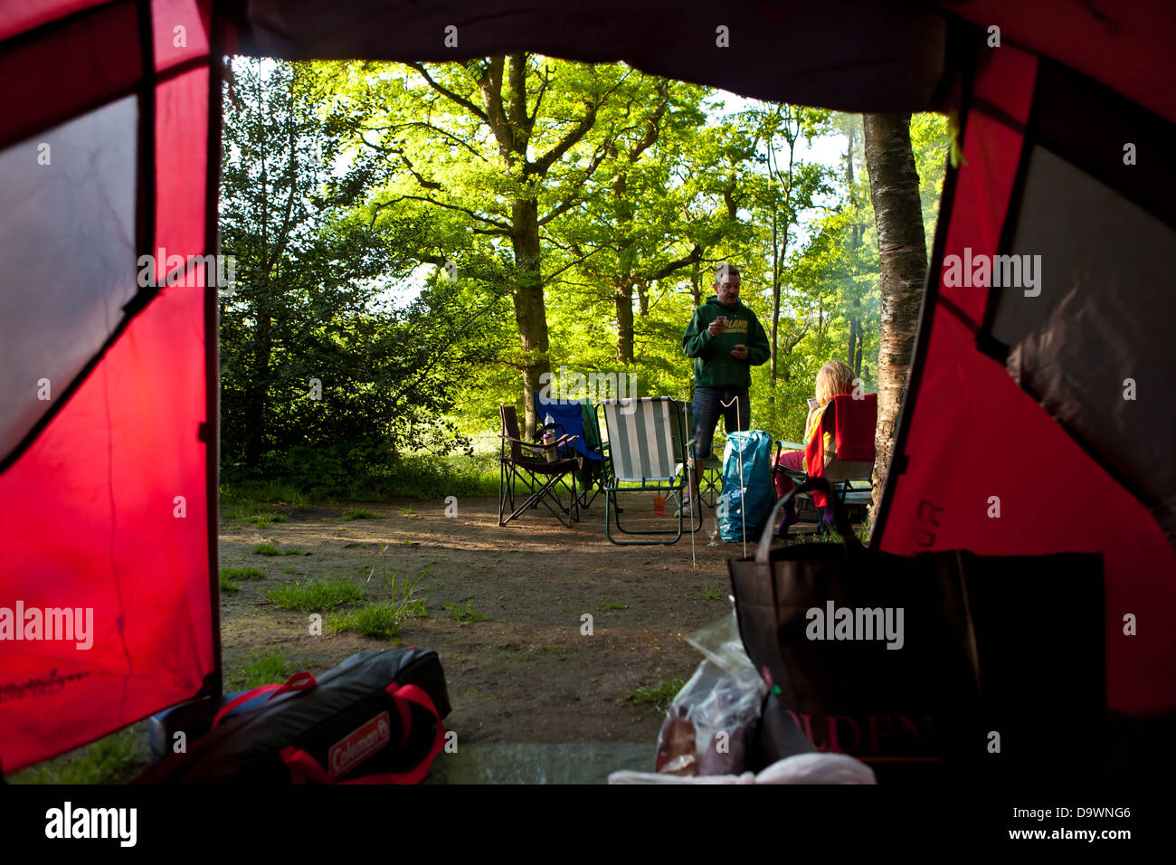 Man camping seen through tent Stock Photo - Alamy